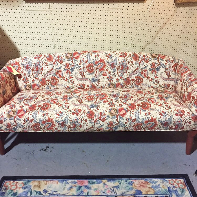 This floral couch isn't just furniture&mdash;it's a statement piece that screams "your grandma's formal living room where no one was allowed to sit."