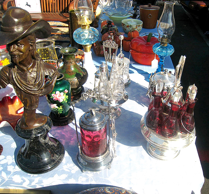 This table tells a hundred stories&mdash;from that John Wayne bust to the delicate oil lamps. Each piece waiting for its next chapter in someone else's home.