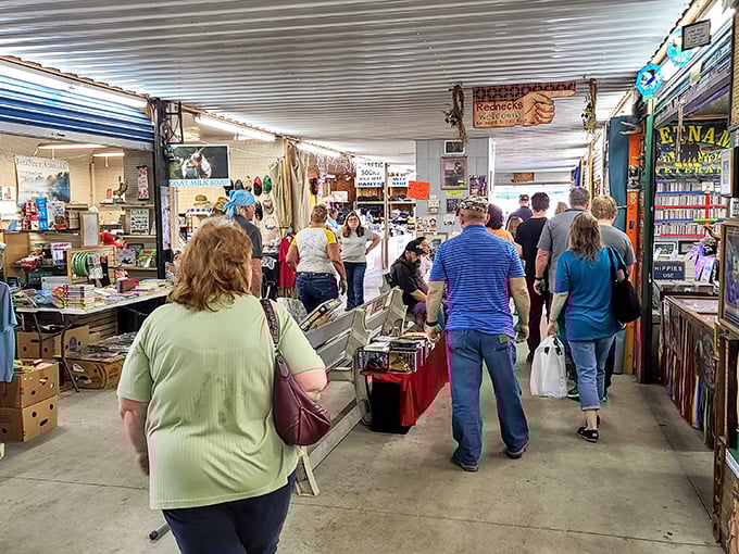 The indoor market hums with activity as shoppers navigate narrow aisles, each person on their own treasure hunt through America's collective attic.