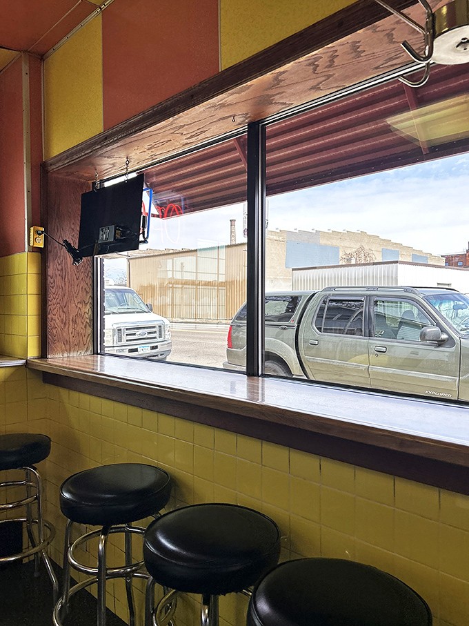 The view from these stools tells the neighborhood's story better than any history book ever could.