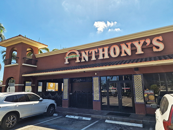 Anthony's terra cotta building with its distinctive tower stands like a pizza lighthouse guiding Fort Lauderdale to coal-fired bliss.