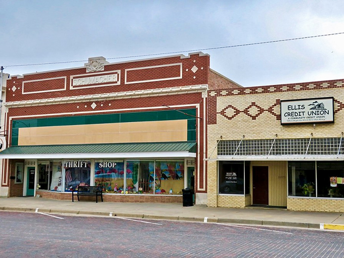 Ellis Community Thrift Shop's vintage storefront fits perfectly on this historic street. Small-town charm with big thrifting potential!
