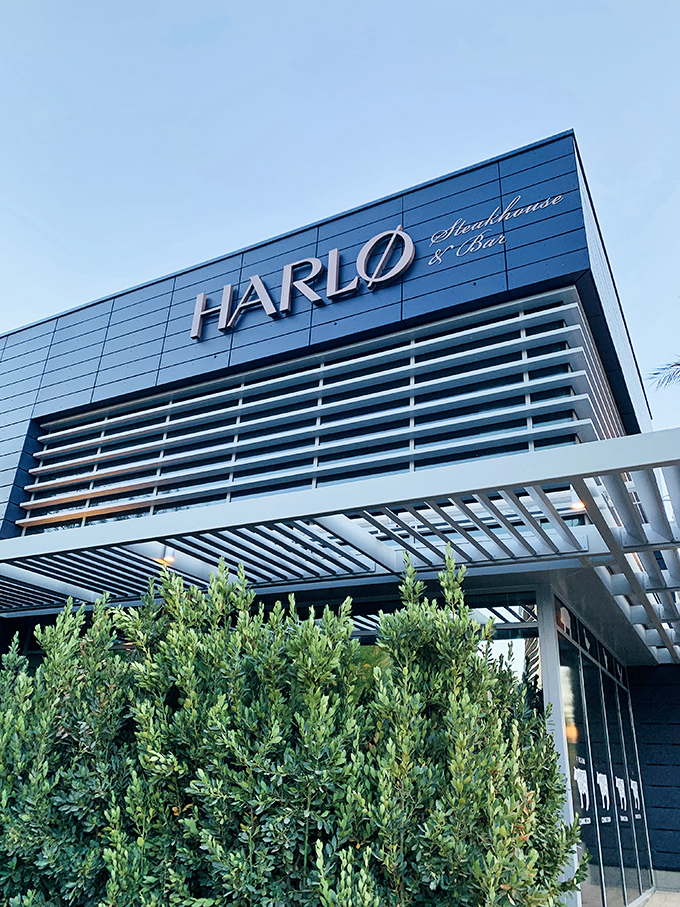 Harlo's sleek blue exterior and minimalist signage whisper "sophisticated dining experience" before you even step through the door.