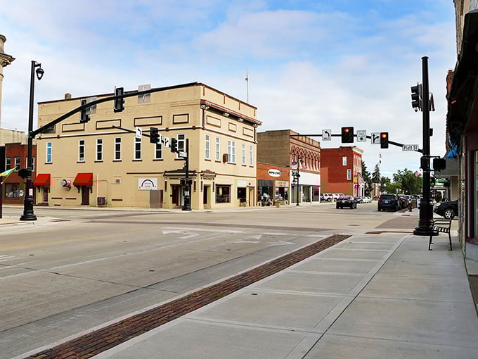 Maquoketa's historic buildings stand tall against a blue Iowa sky, promising affordable living with character.