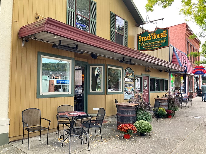 The Steak House's cheerful yellow exterior fits perfectly on Wellsboro's charming Main Street. Small town, big flavors.