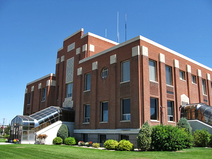 The historic red brick building stands as a centerpiece in downtown Burley, showcasing the town's preserved architectural charm.