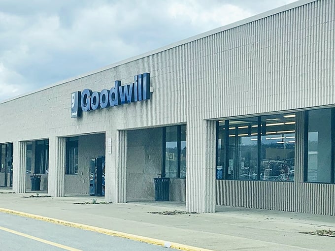 The iconic blue Goodwill sign promises a treasure hunt where yesterday's castoffs become today's finds and tomorrow's vintage collectibles. 