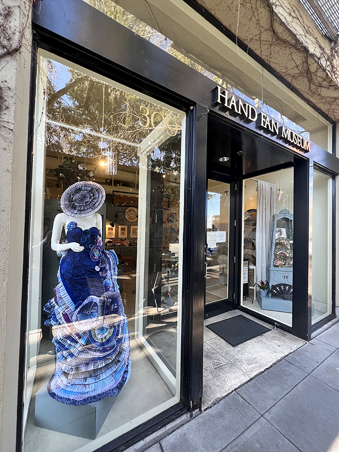 Mannequins showcase the forgotten art of fan-fluttering, when a simple wrist movement could send secret messages across crowded rooms.