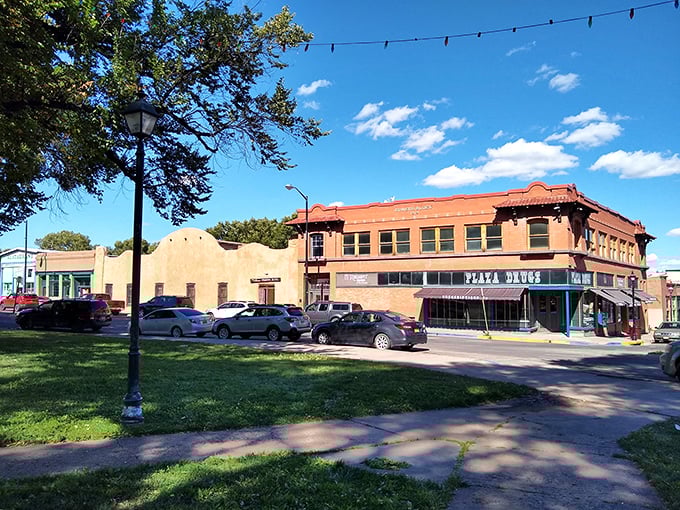 Storm clouds create dramatic backdrop for Las Vegas, New Mexico's historic downtown, where Victorian buildings tell tales of the real Wild West.