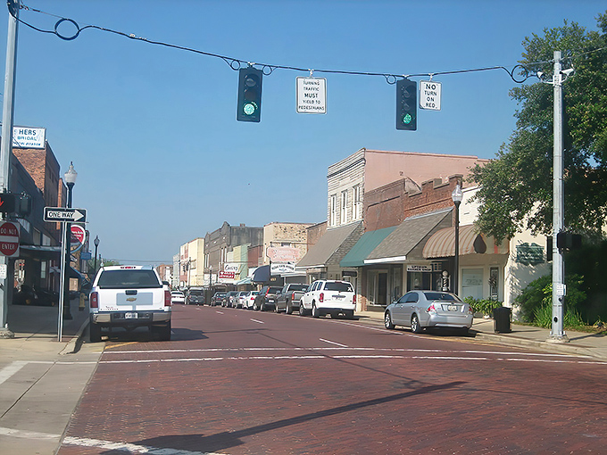 The warm glow of morning light bathes Minden's main street in golden hues, highlighting the charm of this hidden Louisiana gem.