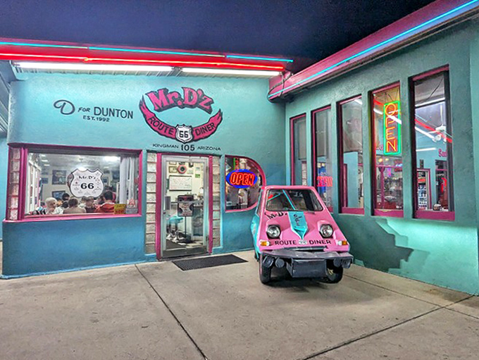 The playful pink and turquoise facade houses burgers that have fueled westward dreams since Elvis was on the radio.