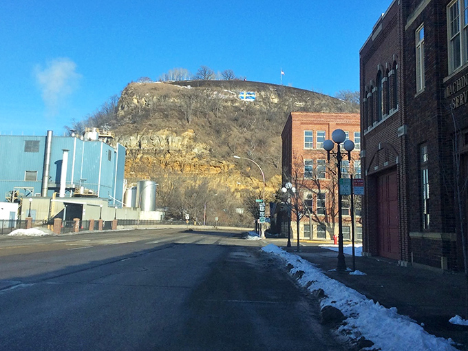 The mighty Mississippi flows past Red Wing's industrial district, where the bluffs stand sentinel over this historic river community.