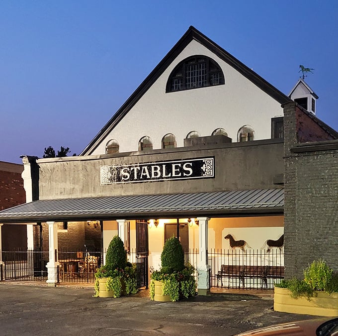 The black and white exterior of Stables houses colorful flavors inside, where history and culinary expertise create the perfect dining partnership.
