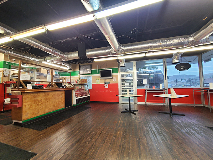 Italian colors on simple walls tell the story - authentic pizza made with genuine neighborhood pride.