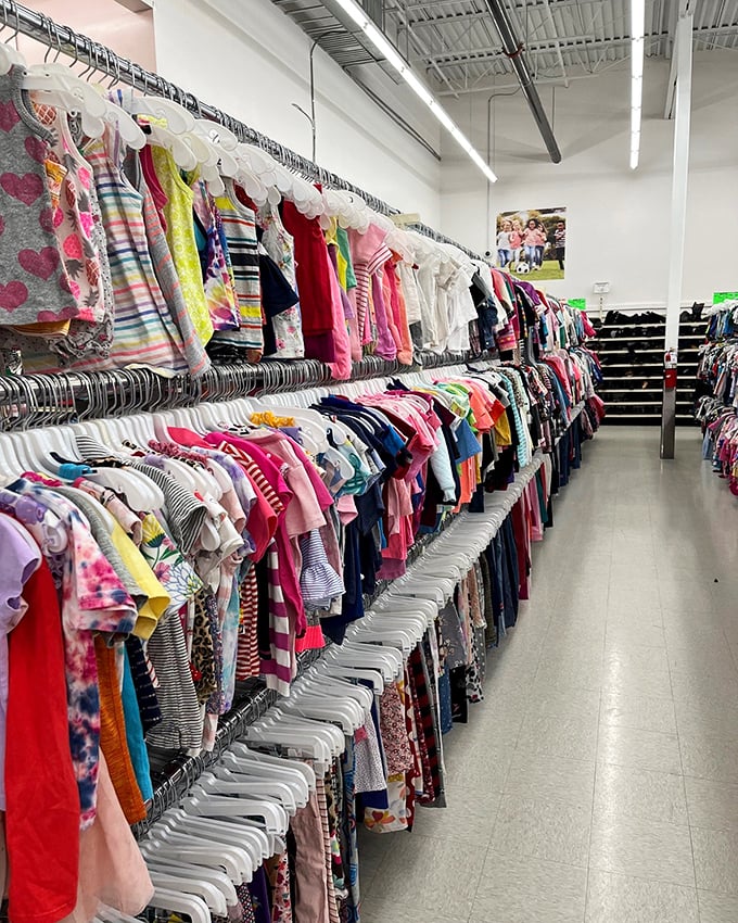 Rainbow rows of children's clothes at Village Discount &ndash; where growing kids and shrinking budgets find harmony.