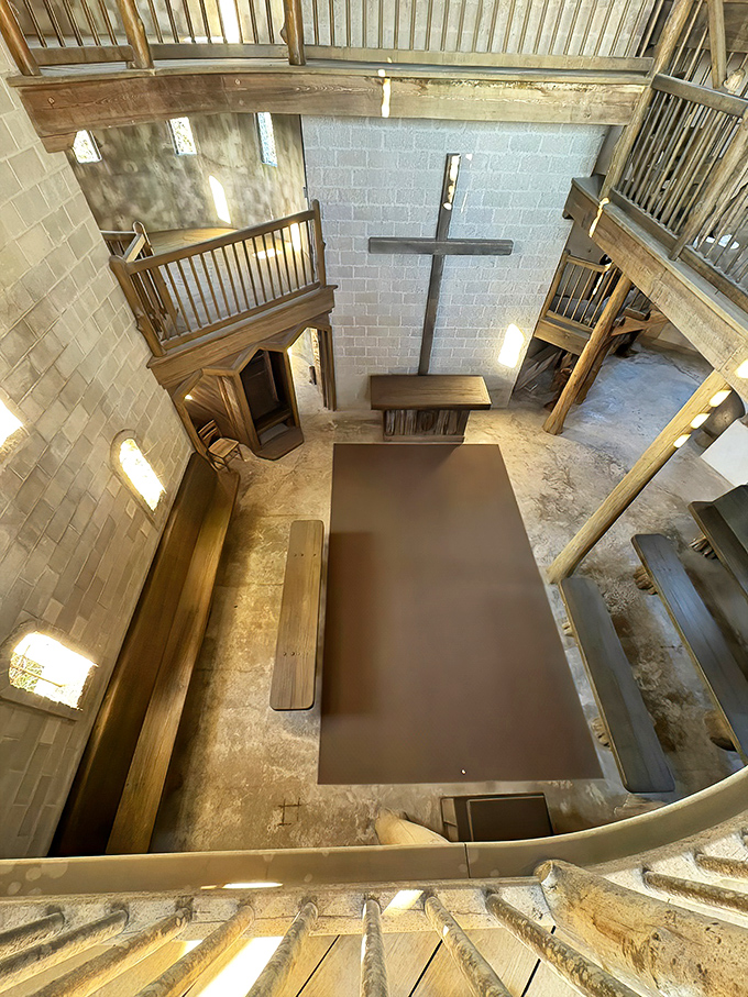 From this bird's-eye view, the castle's interior reveals itself as a masterful blend of medieval architecture and sacred space.