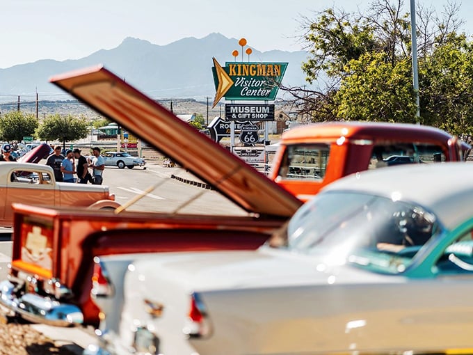 Classic cars line up in Kingman during the Route 66 Fun Run, chrome gleaming like jewelry against the desert backdrop.