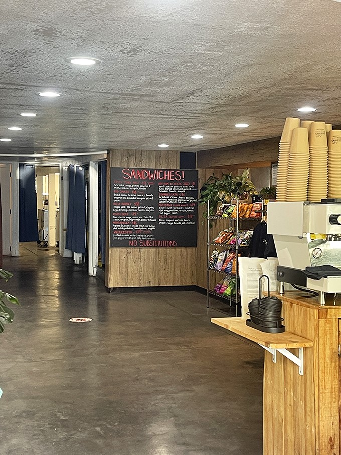 Modern minimalism meets sandwich craftsmanship. The clean lines and wood accents create a space where food, not decor, remains the undisputed star.