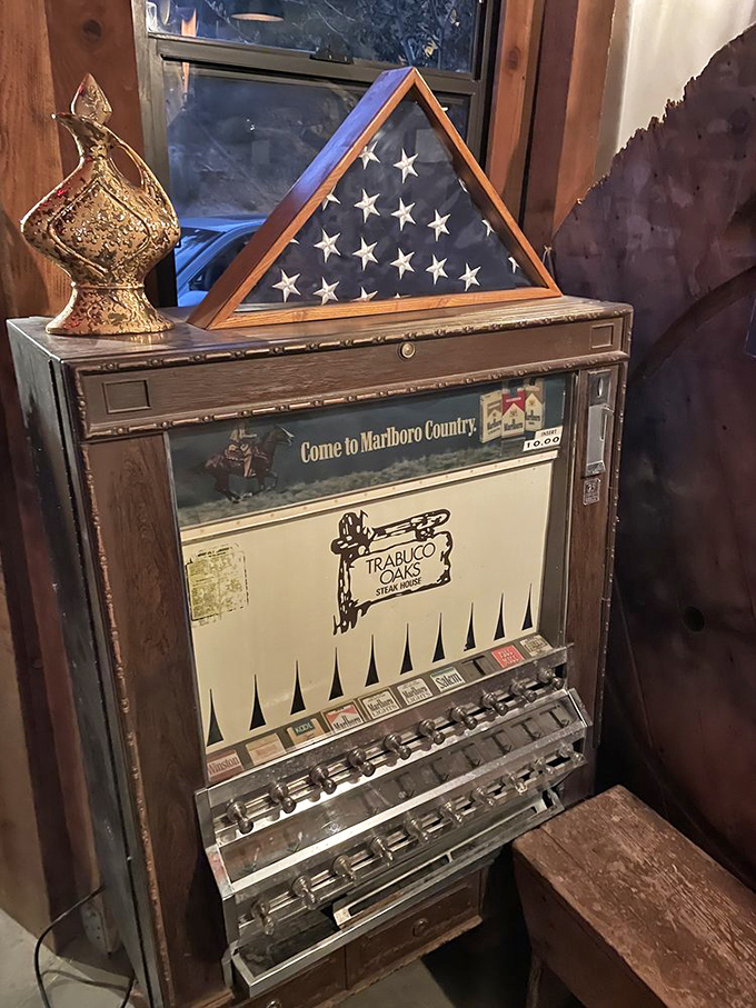 Vintage cigarette machine adds nostalgic charm, reminding diners of simpler times and classic Americana vibes.