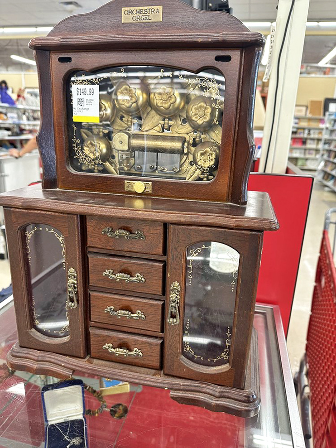 An antique music box cabinet that probably serenaded families through decades of Sunday dinners together.