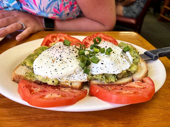 Avocado toast that actually deserves its Instagram fame &ndash; perfectly poached eggs atop creamy avocado with juicy tomatoes creating a breakfast color palette worthy of the Keys.