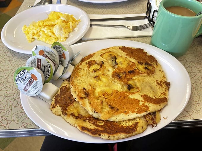 These pancakes aren't just breakfast; they're an edible sunbeam with a side of nostalgia. The coffee mug's turquoise charm is just a bonus.
