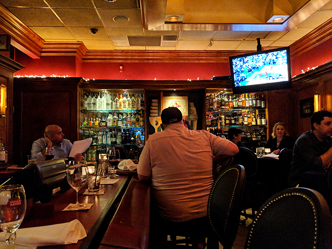 The bar's amber glow creates the perfect backdrop for that "one more drink" that somehow turns into fascinating conversations with strangers.