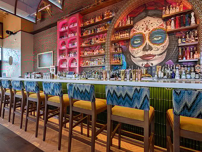 A bar that takes its tequila seriously, complete with Day of the Dead artwork watching over the spirits. Those pink shelves aren't just shelves&mdash;they're tequila temples.