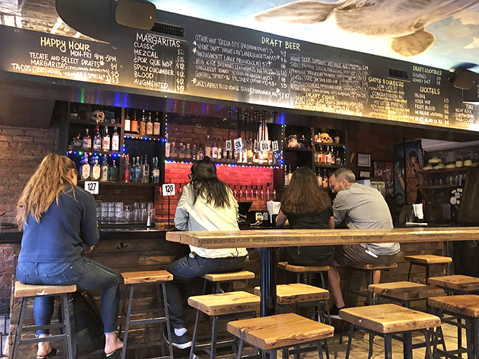 Where decisions are made and thirsts are quenched. The chalkboard menu promises liquid happiness in various forms and strengths.