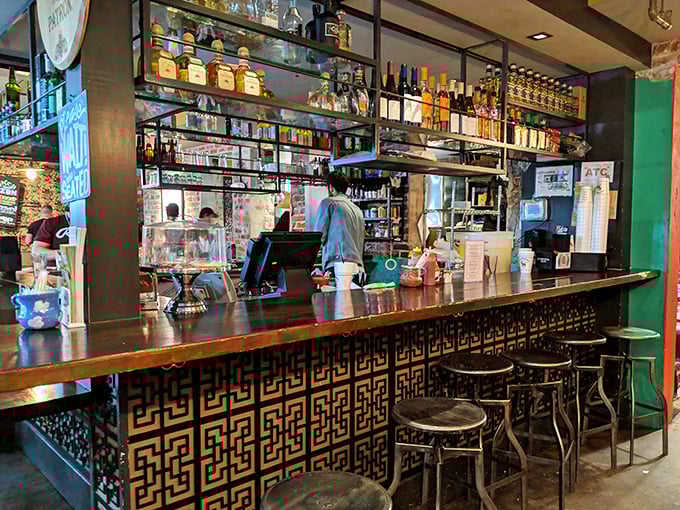 The bar isn't just where drinks are made&mdash;it's command central for flavor operations, with bottles standing at attention like soldiers ready for delicious duty.