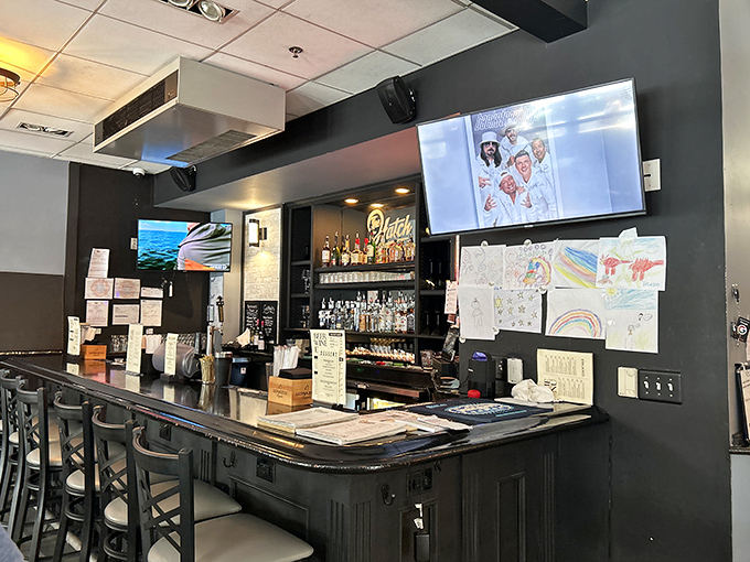 The bar area – where strangers become friends over craft cocktails and shared recommendations about which mac and cheese bowl reigns supreme.
