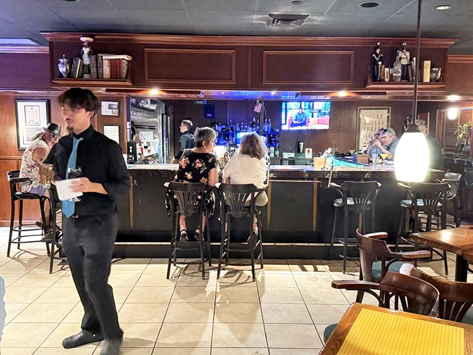 The bar area balances retro charm with serious cocktail craftsmanship. These bartenders have forgotten more recipes than most mixologists know.