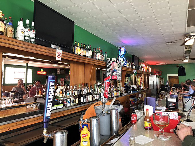 The well-stocked bar reminds you this isn't just a restaurant&mdash;it's a neighborhood institution where stories are shared over cold drinks.