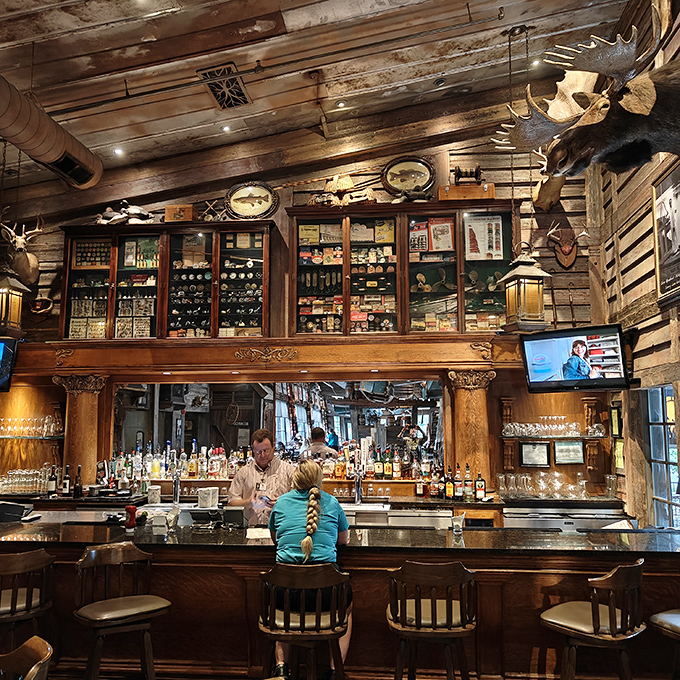 A bar that would make Hemingway feel at home. Under the watchful gaze of mounted trophies, cocktails are crafted with the same care as the entrées.