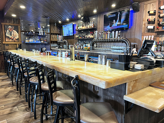 A bar that invites you to settle in, where the amber glow of bottles promises stories shared between strangers who'll leave as friends.