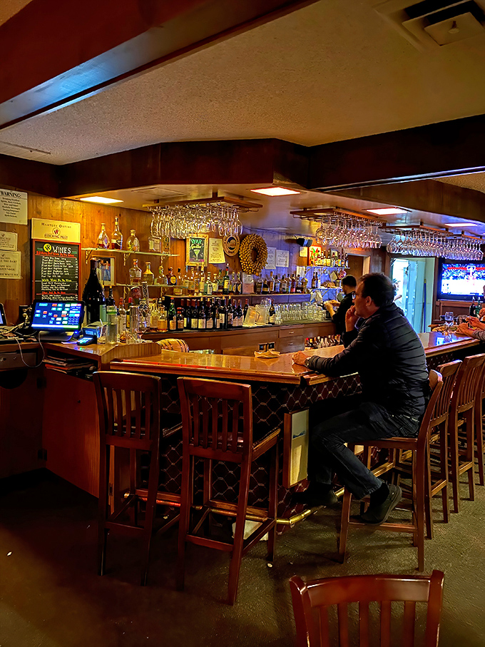 The bar area&mdash;where solo diners become temporary best friends and wine recommendations flow as freely as the conversation.