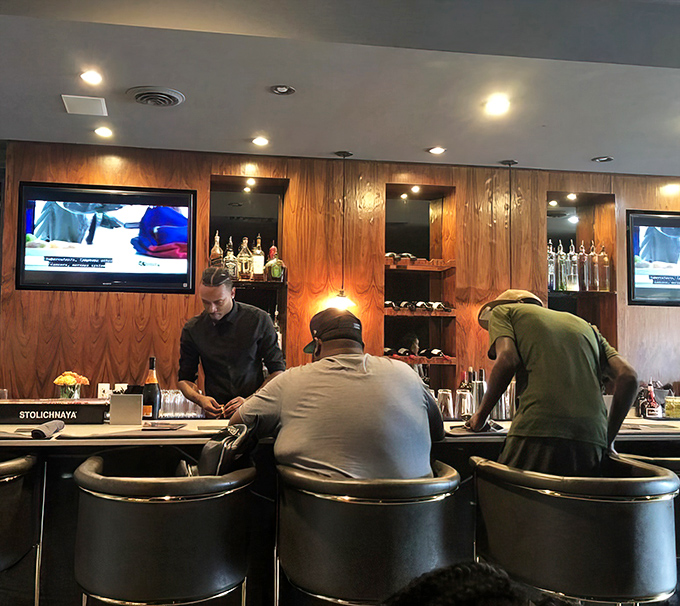 The bar area &ndash; where seafood stories are shared and cocktails flow. A wood-paneled sanctuary for crab cake enthusiasts.