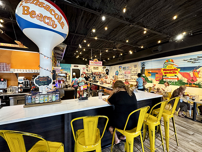 Yellow bar stools and a water tower replica&mdash;because nothing says "coastal casual" like primary colors and whimsical local landmarks.