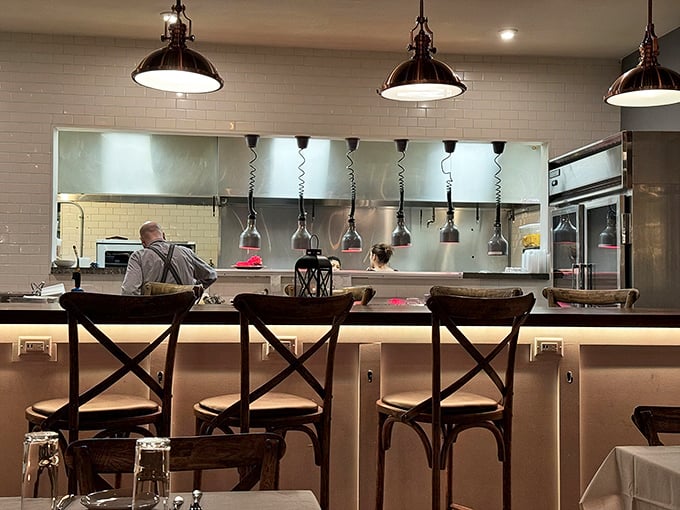 The open kitchen bar seats offer dinner and a show&mdash;watch culinary professionals turn raw ingredients into edible poetry.