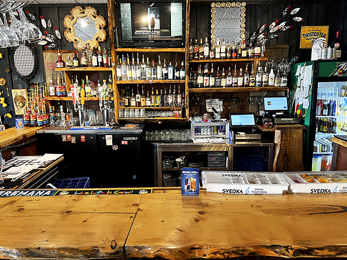 A bartender's canvas of bottles and wood. This isn't just where drinks are made&mdash;it's where memories begin their journey.