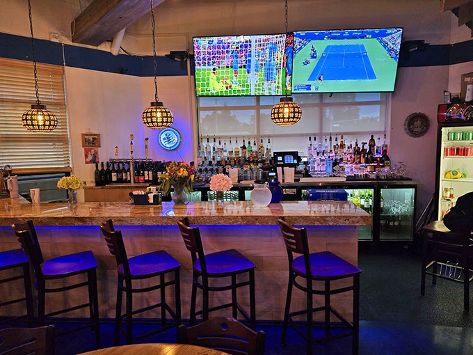 The bar area glows with possibility and pendant lights. Those TVs mean you won't miss the game, but the food ensures you won't really care who's winning.