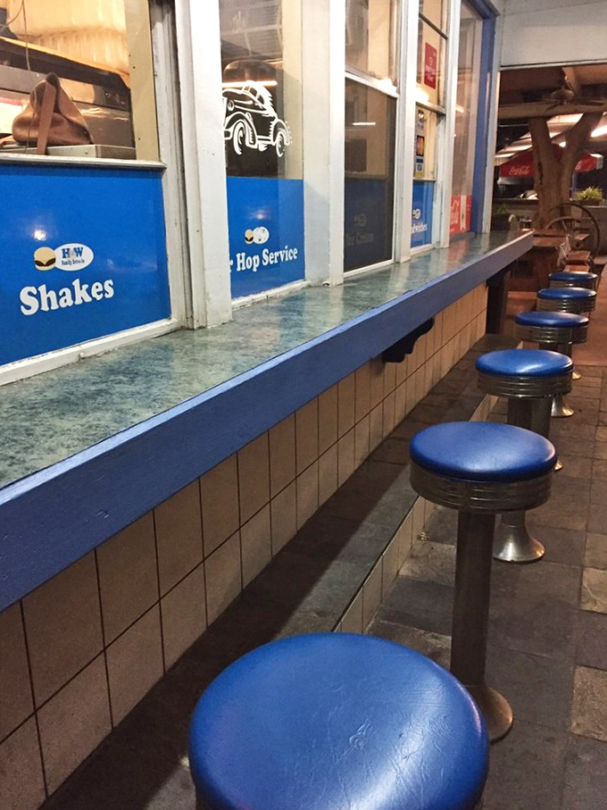 Classic blue counter stools await your presence&mdash;the perfect perch for people-watching while contemplating your next bite.
