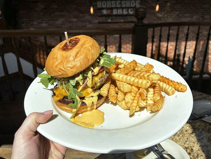 A burger that requires both hands and a strategy. Those fries look like they've been to finishing school.