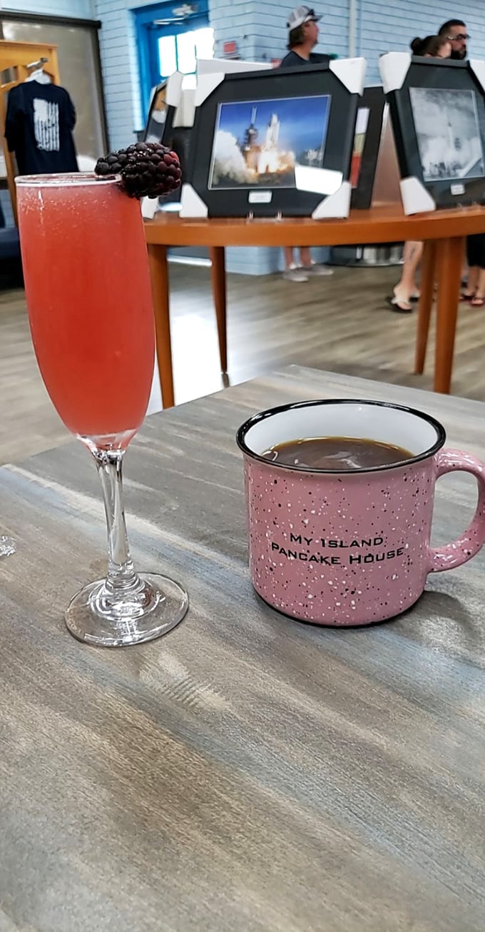 Morning perfection: a fruity mimosa alongside coffee in their signature mug, with space memorabilia in the background honoring the nearby Kennedy Space Center.