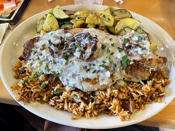 Blackened fish that would make a New Orleans chef tip his hat. Resting on a bed of rice like royalty on a throne of flavor.