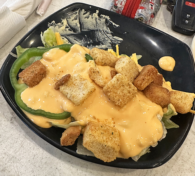 This salad, draped in house-made dressing and crowned with crunchy croutons, makes eating vegetables feel like cheating on your diet.