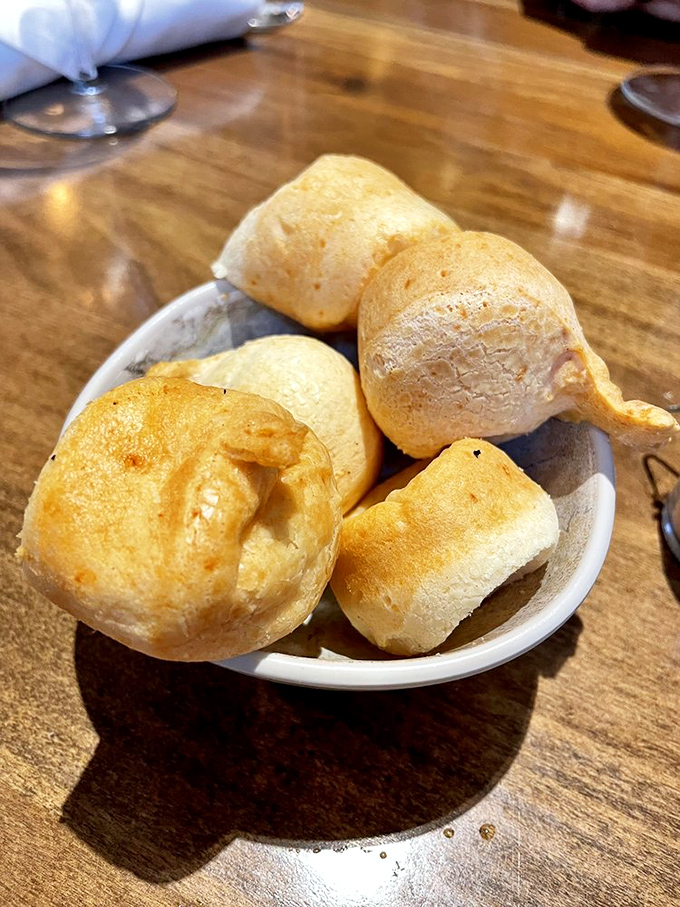 Cheese bread balls that should come with a warning label. These addictive p&atilde;o de queijo puffs have caused otherwise reasonable adults to fight over the last one.
