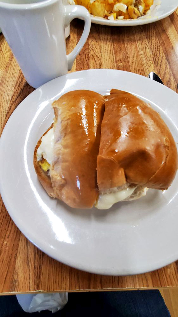 The breakfast sandwich that requires a game plan. Melty cheese escaping from a golden-brown bun&mdash;this is how champions start their day.