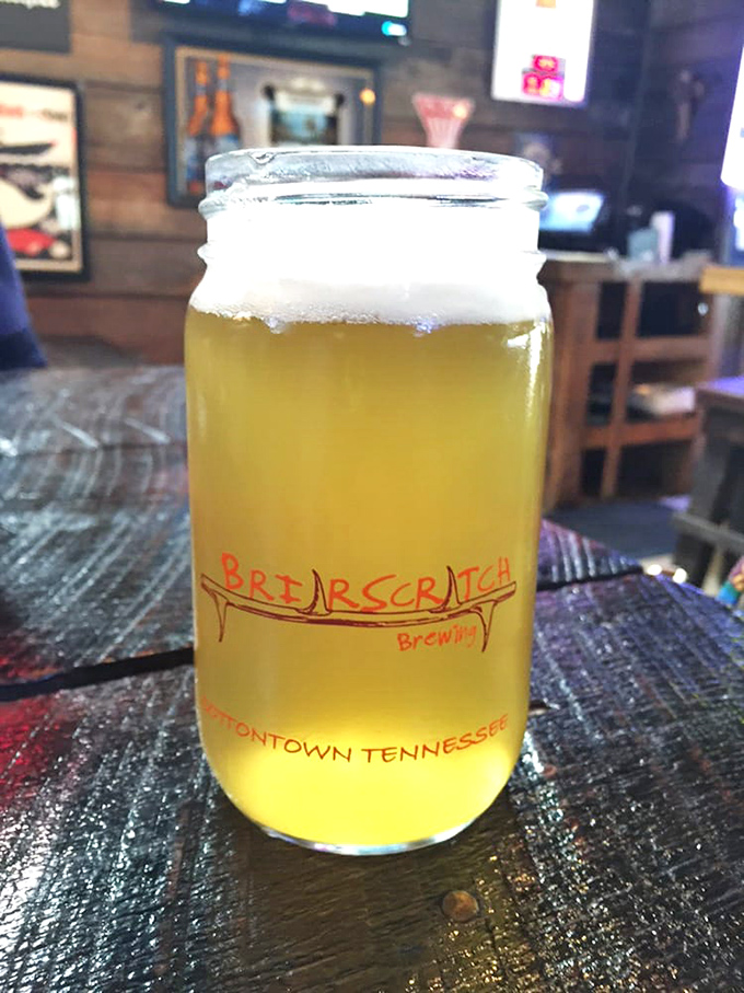 A mason jar of golden brew from BriarScratch, because nothing complements seafood quite like a locally crafted liquid sunset.