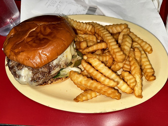 The cheeseburger that time forgot&mdash;in the best possible way. Melted American cheese cascades down a hand-formed patty like a yellow waterfall of nostalgia.
